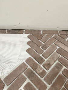 How to install herringbone brick floor tile - Jenna Sue Design