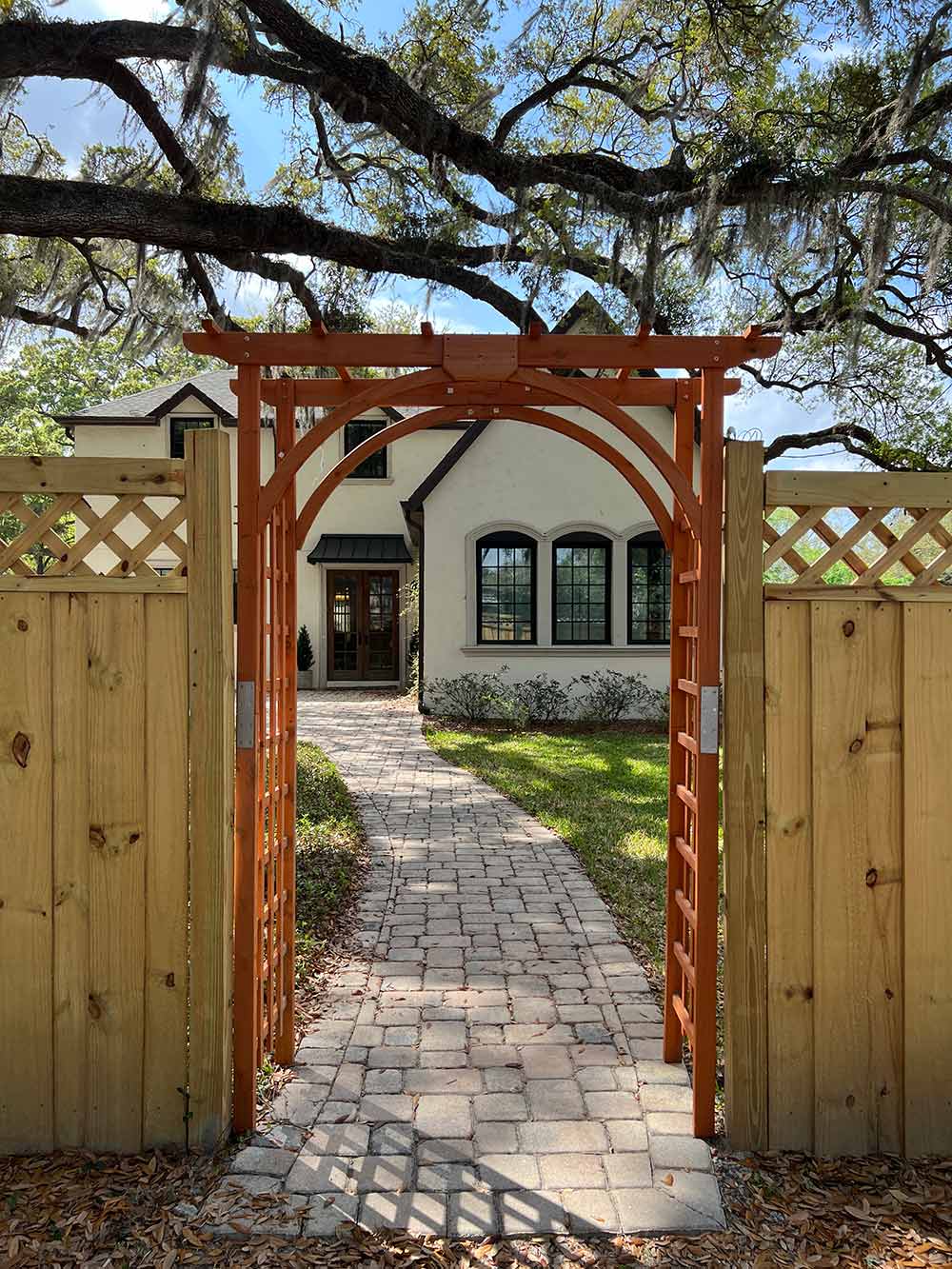 Black wood fence and DIY arbor reveal - Jenna Sue Design