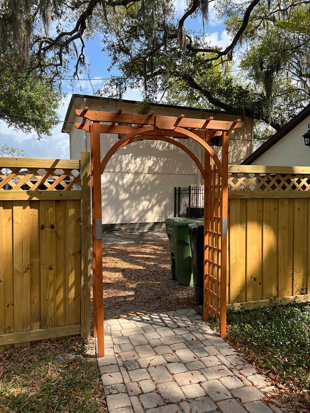 Black wood fence and DIY arbor reveal - Jenna Sue Design