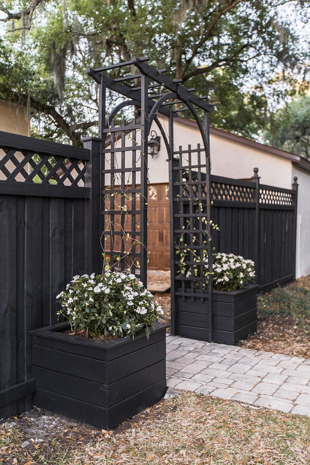 Black wood fence and DIY arbor reveal - Jenna Sue Design